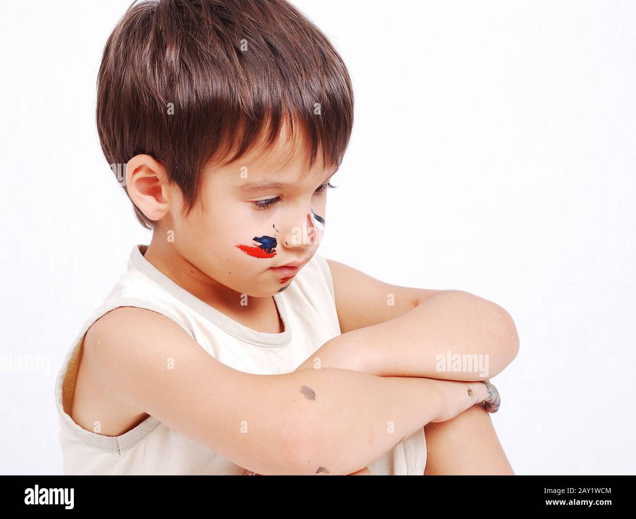 Little cute kid with colors on his face Stock Photo - Alamy