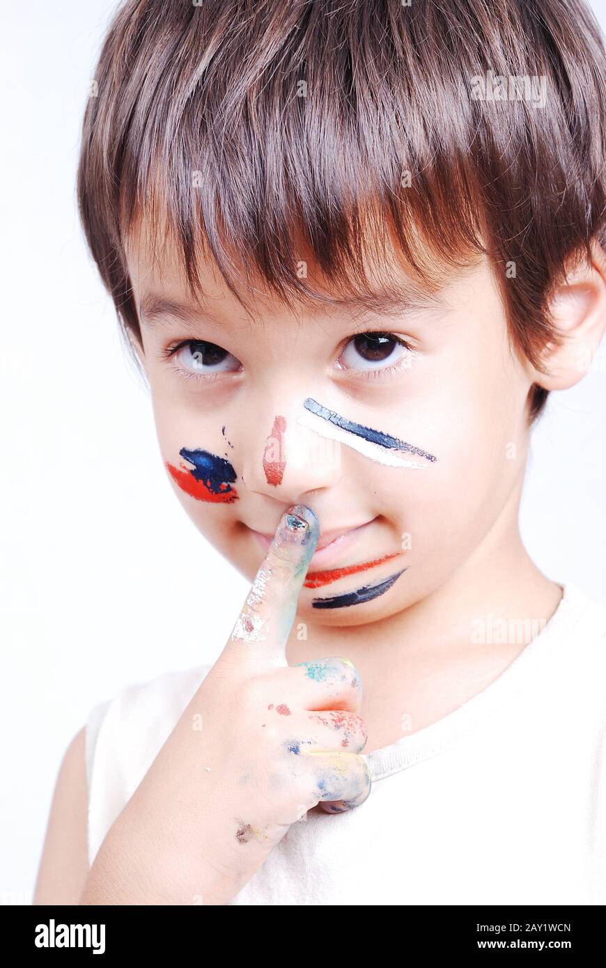 Little cute kid with colors on his face Stock Photo - Alamy