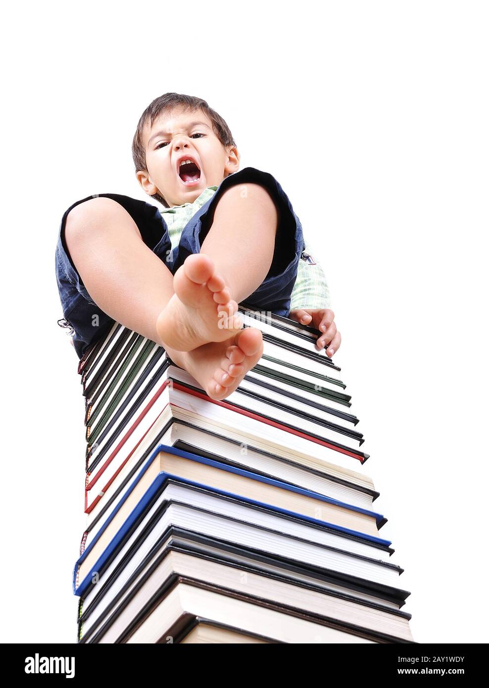 Book tower made of many books and person Stock Photo - Alamy