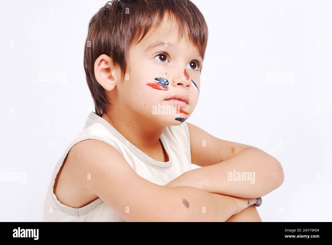 Little cute kid with colors on his face Stock Photo - Alamy