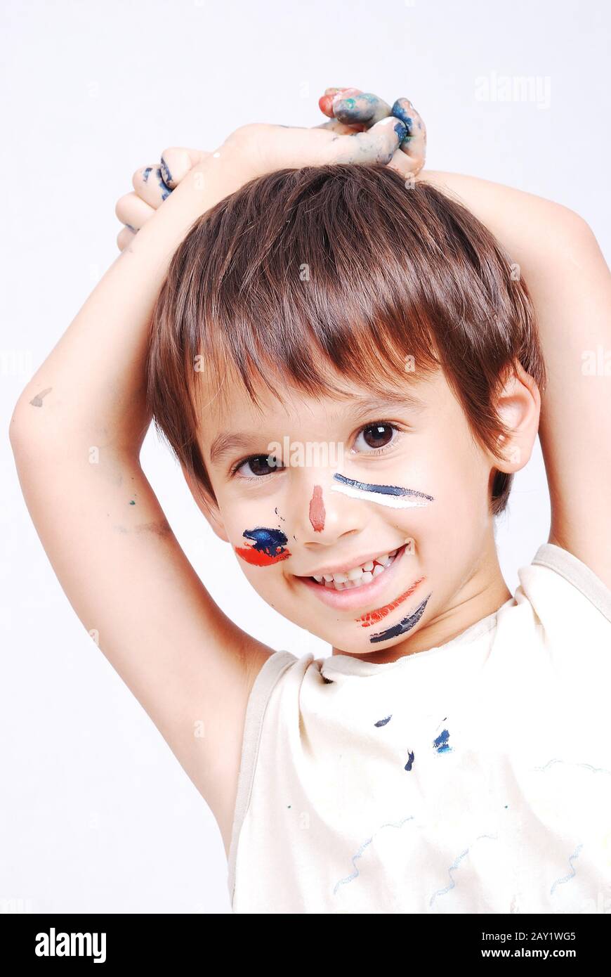 Little cute kid with colors on his face Stock Photo - Alamy