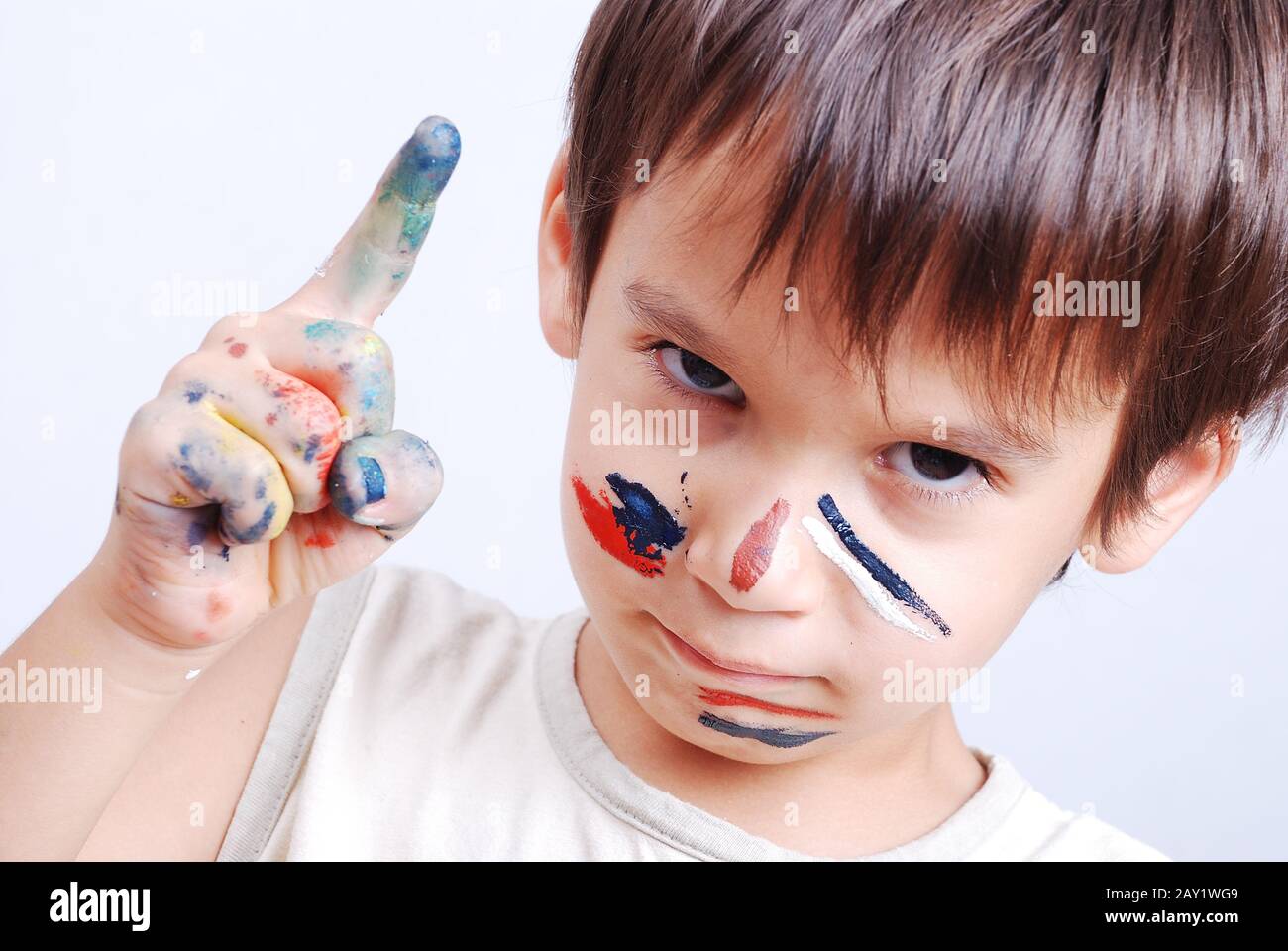 Little cute kid with colors on his face Stock Photo - Alamy