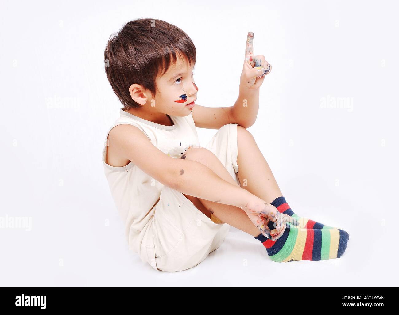 Little cute kid with colors on his face Stock Photo - Alamy