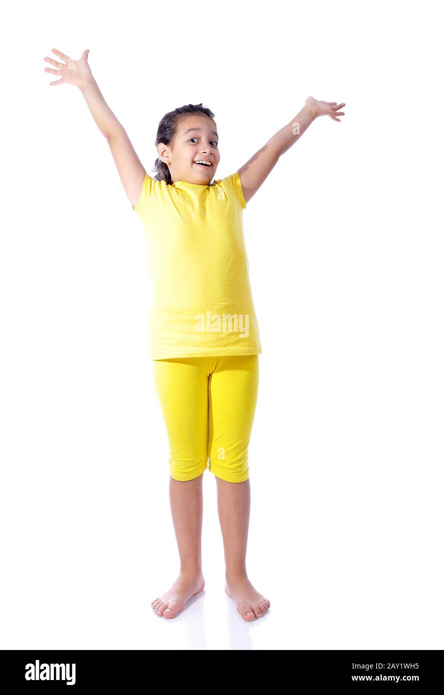Beautiful cute girl in yellow clothes isolated Stock Photo - Alamy