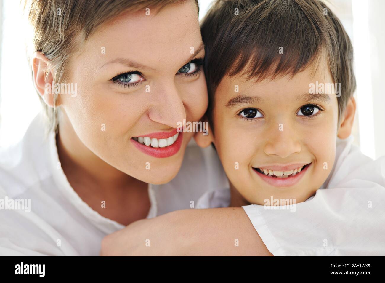 Happy mother hugging her son Stock Photo - Alamy