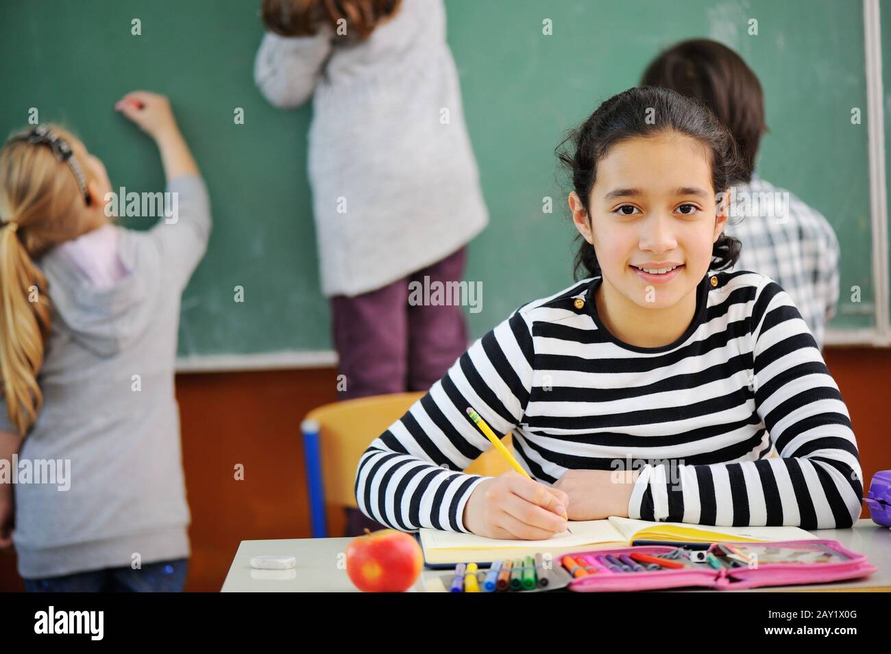 Portrait of a beautiful girl in school classroom Stock Photo - Alamy