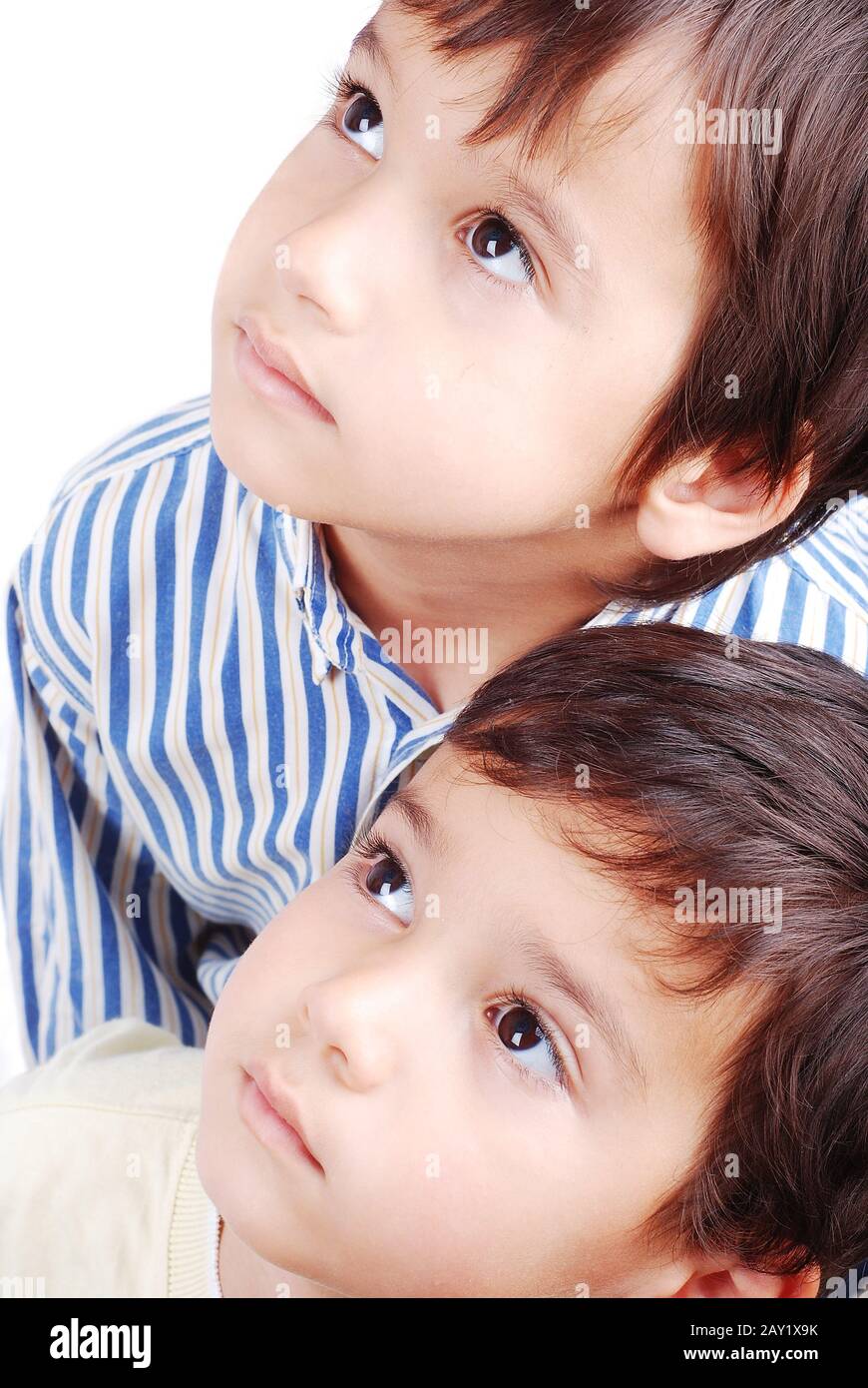 Two very cute boys are looking above Stock Photo - Alamy