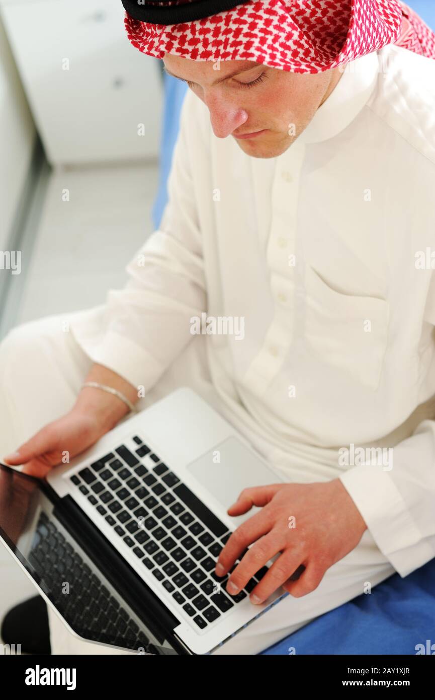 Arabic man with laptop Stock Photo - Alamy