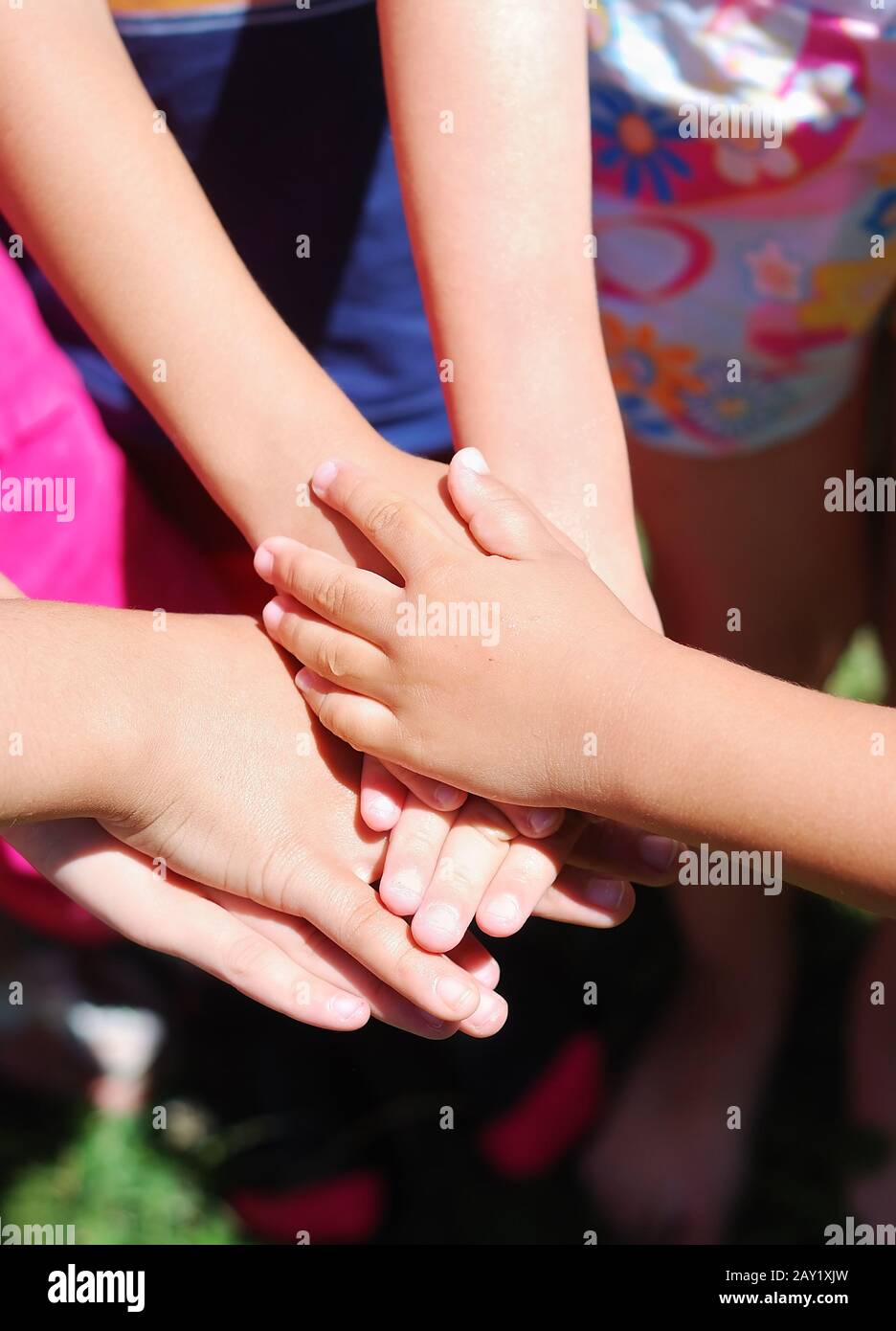 Many hands one on the other together Stock Photo - Alamy