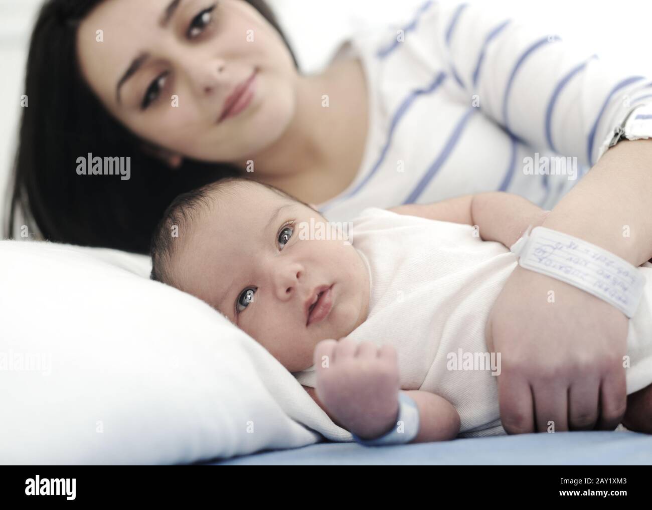 Middle eastern woman with her baby at hospital ro Stock Photo - Alamy