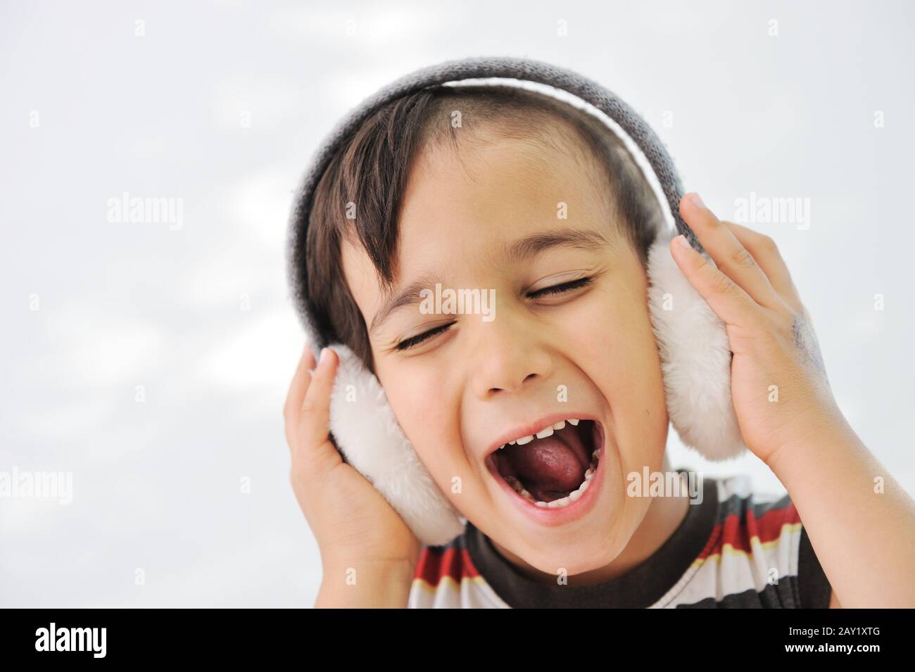 Happy singing boy Stock Photo - Alamy