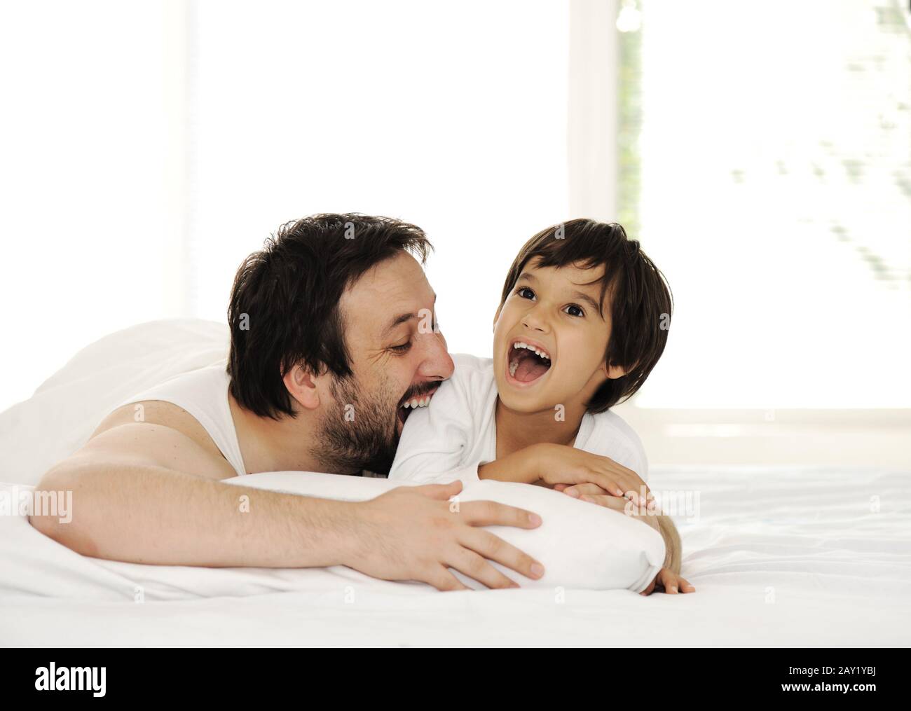 Father and son in bed Stock Photo - Alamy