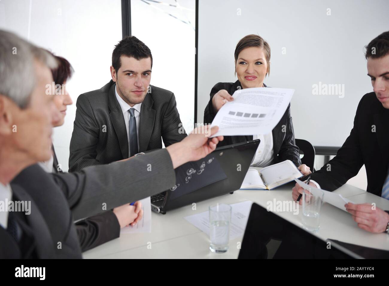 Giving a task at business meeting Stock Photo - Alamy