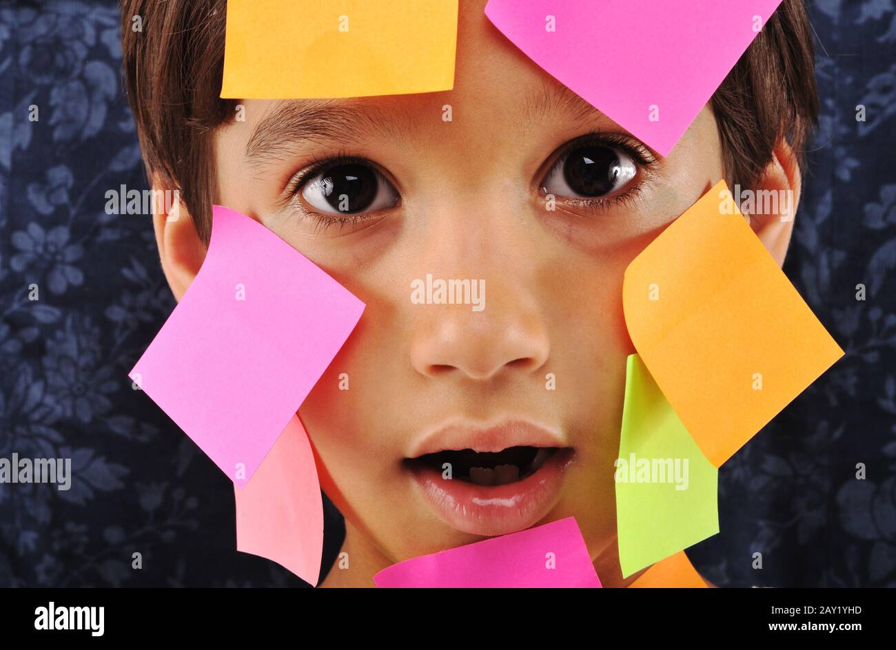 Little boy with memo posts on his face Stock Photo - Alamy