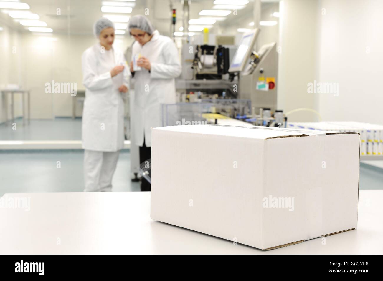 White box at automated production line at modern factory - ready for ...