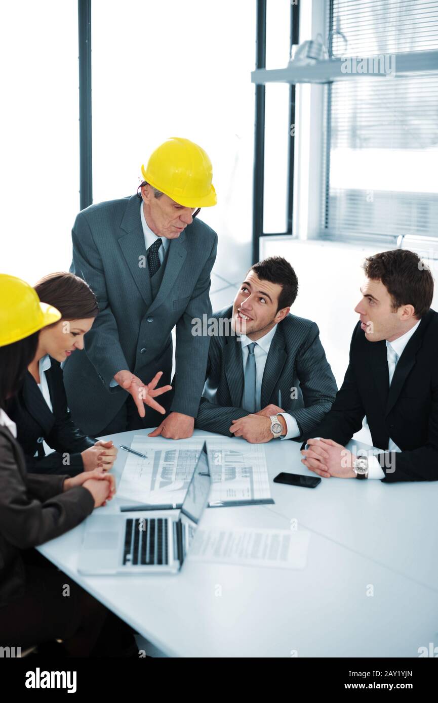 Boss talking to colleagues Stock Photo - Alamy