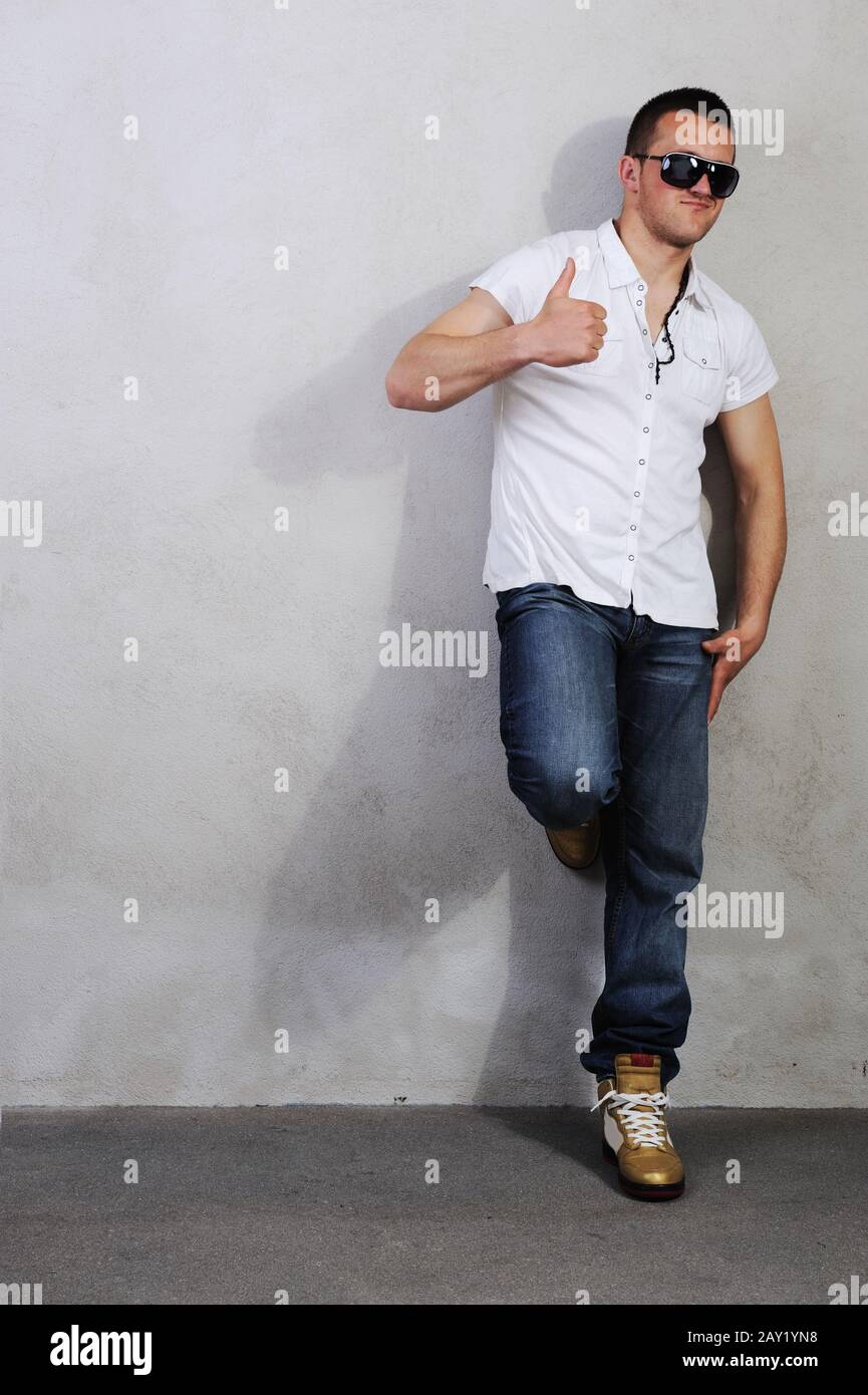 Young macho man in different poses Stock Photo - Alamy