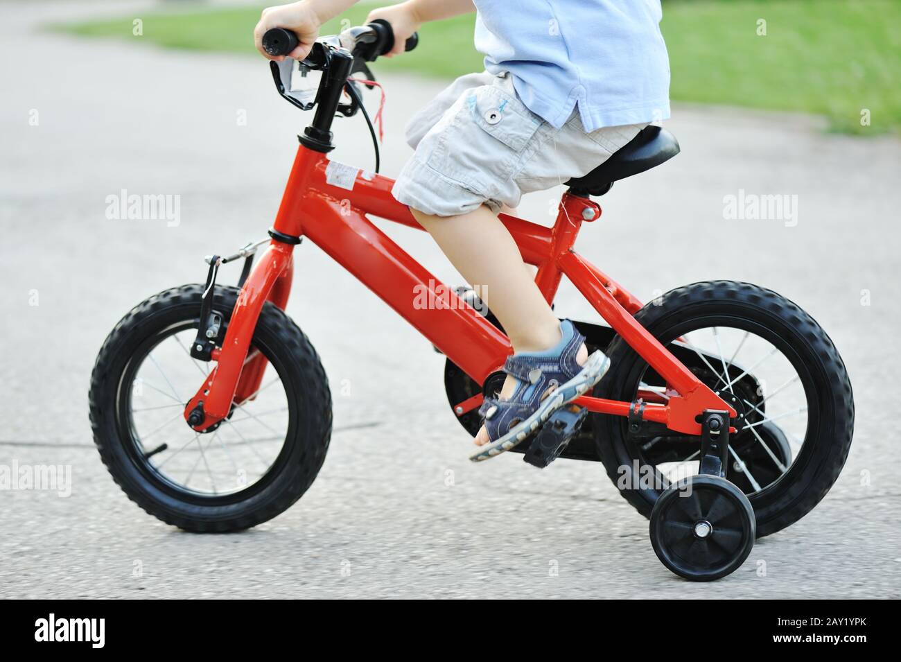 Kid riding cycle Stock Photo - Alamy
