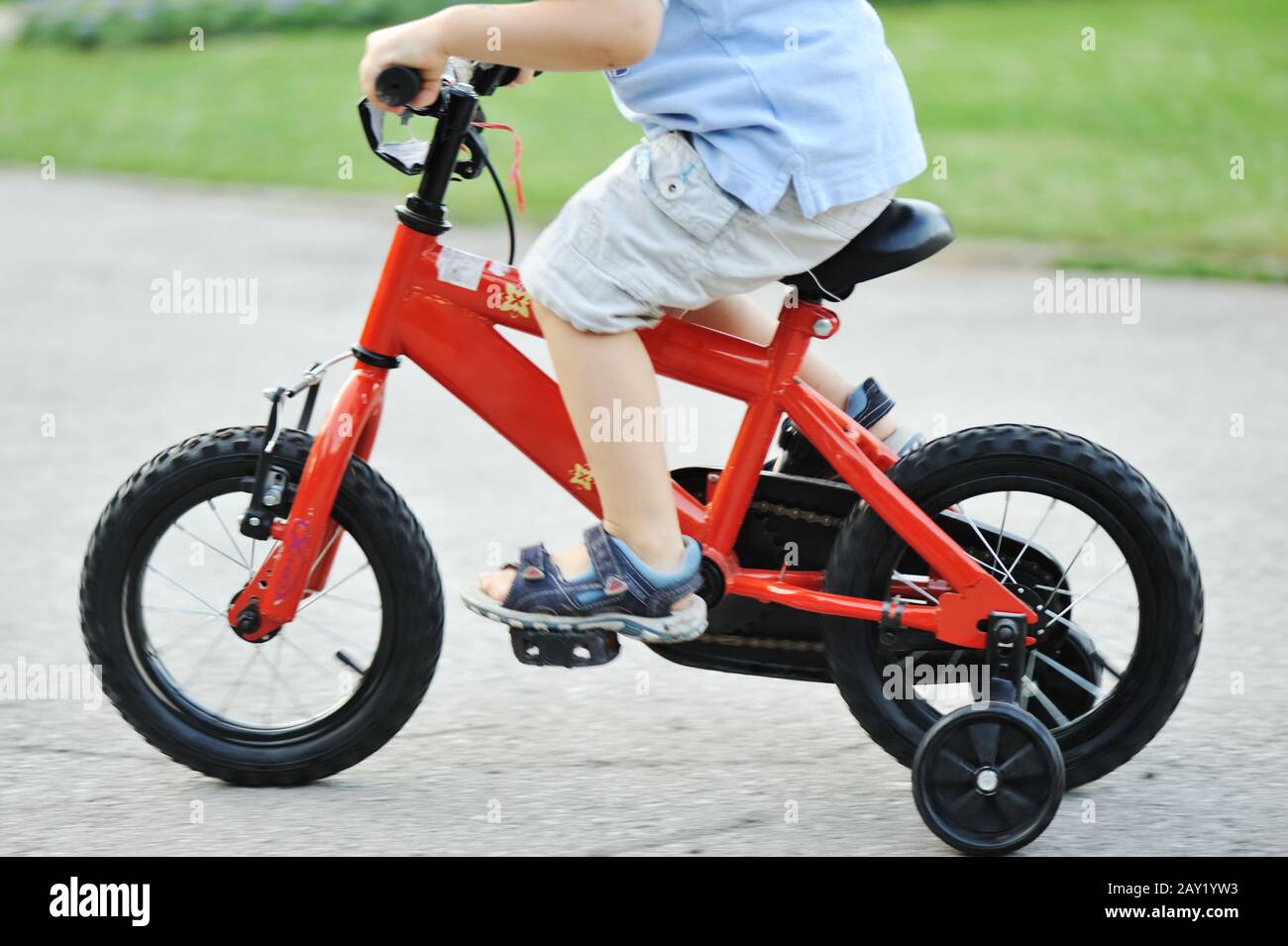 Kid riding cycle Stock Photo - Alamy