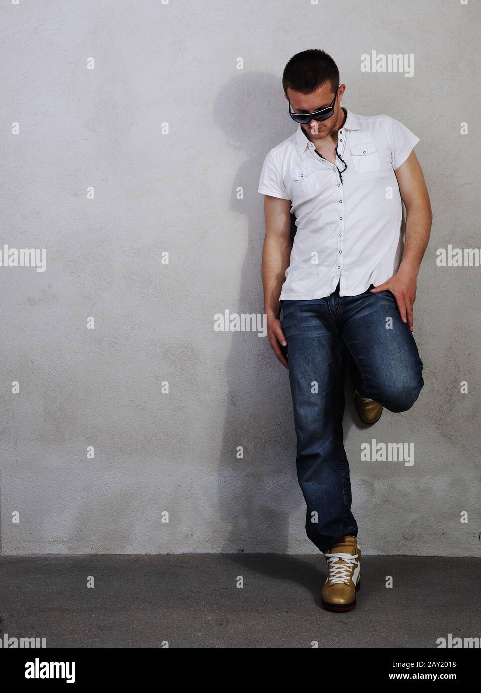 Young macho man in different poses Stock Photo - Alamy