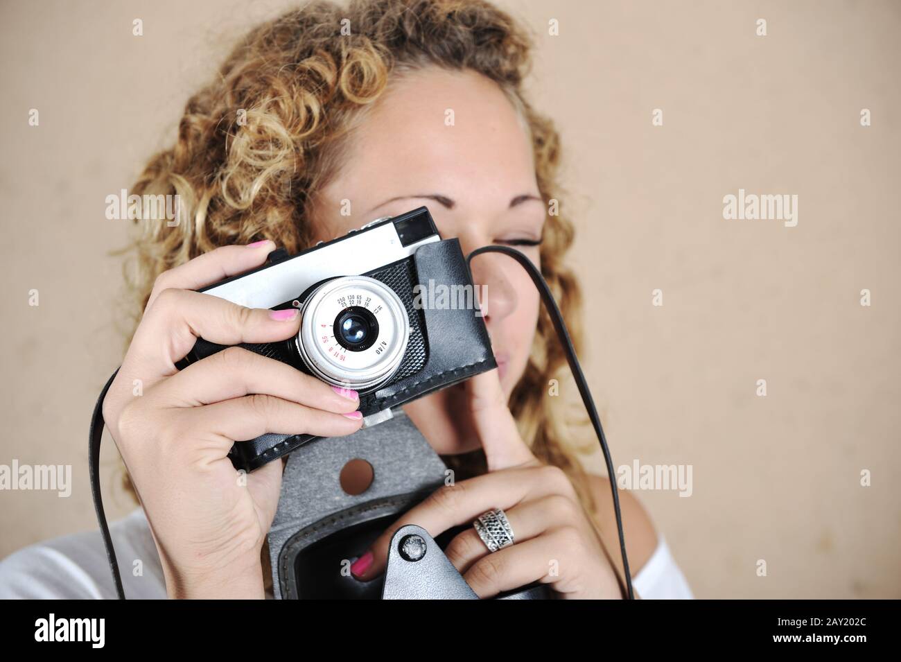 Blonde girl with retro camera Stock Photo - Alamy