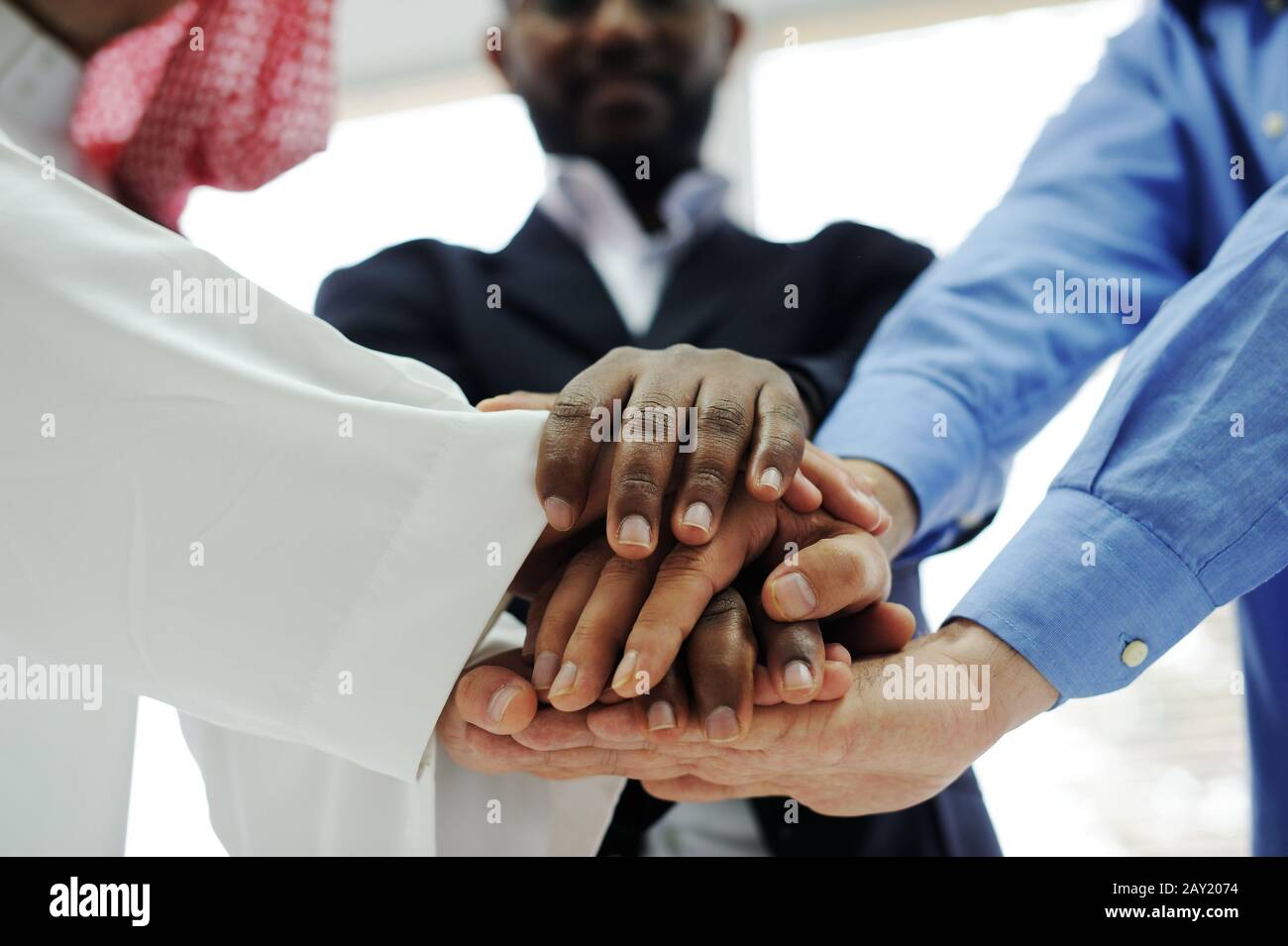 Overlapping hands hi-res stock photography and images - Alamy