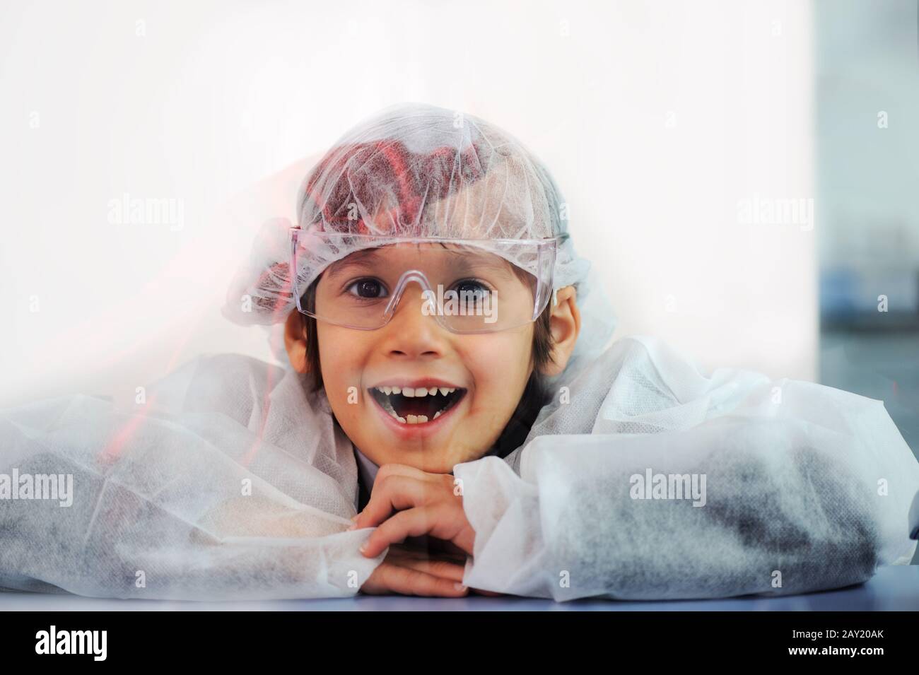 Smart cute little male child experimenting with test tubes in real ...