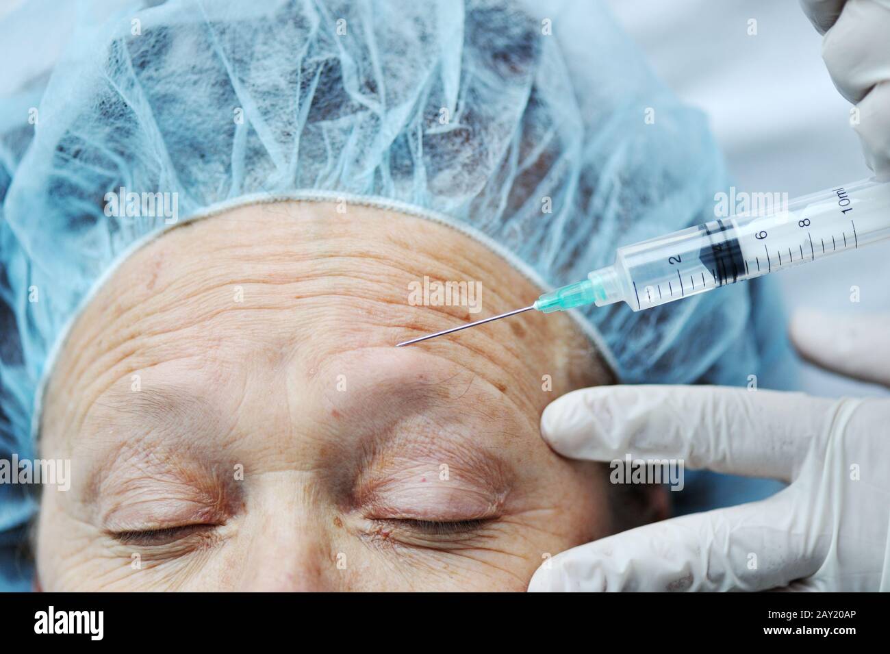 Elderly woman getting Botox injection procedure Stock Photo - Alamy