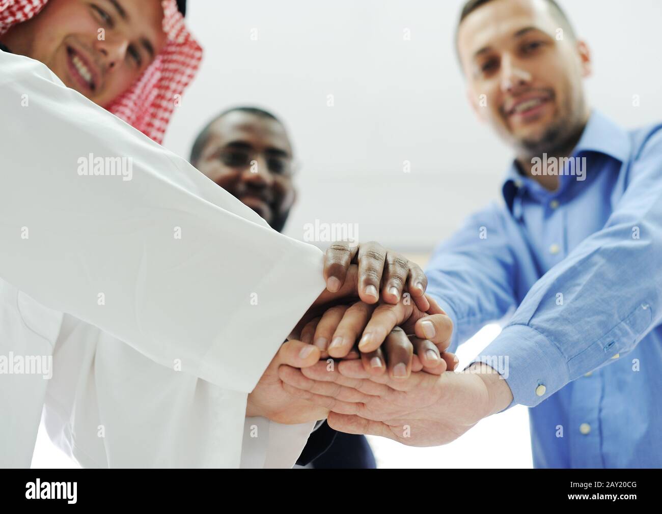 Overlapping hands hi-res stock photography and images - Alamy