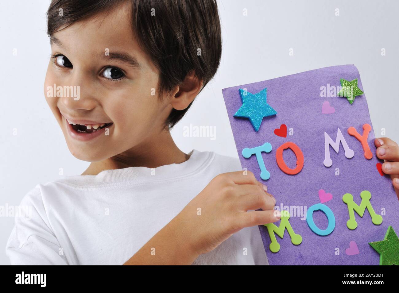 Kid holding message for lovely Mom Stock Photo - Alamy