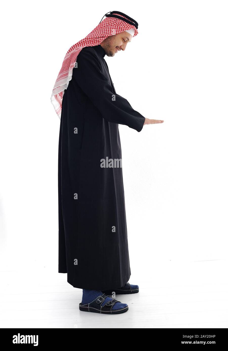 Arabic man looking up and down Stock Photo - Alamy