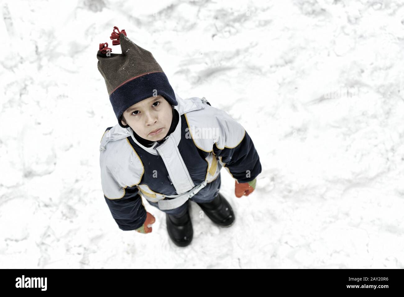Angry kid on snow Stock Photo - Alamy