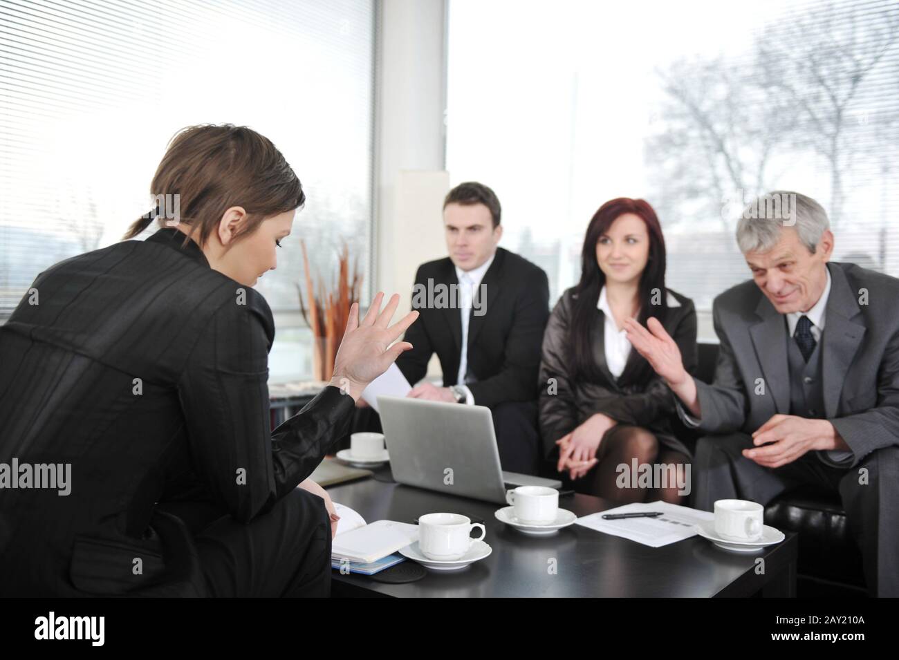 Confident job applicant having interview hi-res stock photography and ...