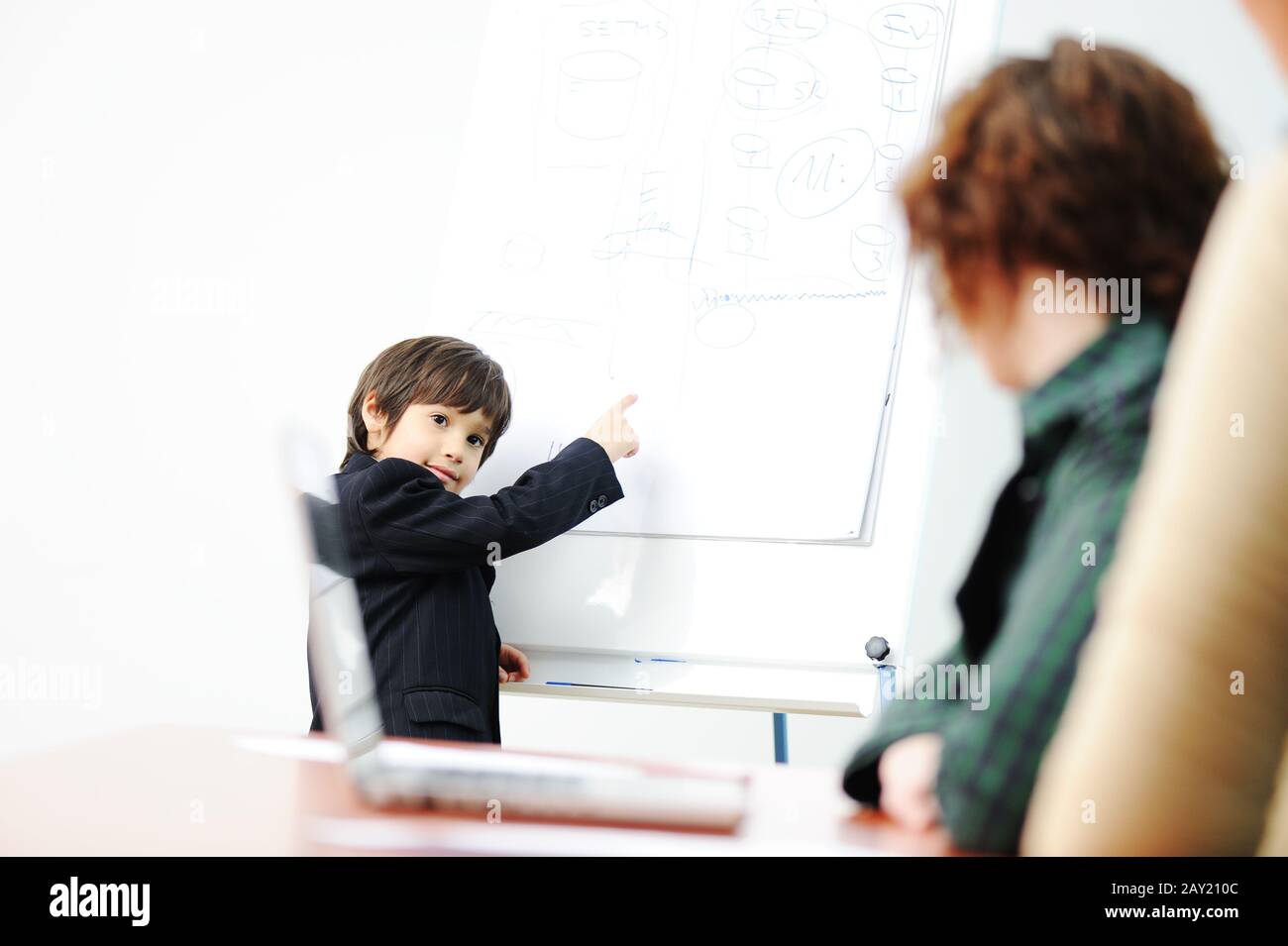 Smart boy giving showing hi-res stock photography and images - Alamy