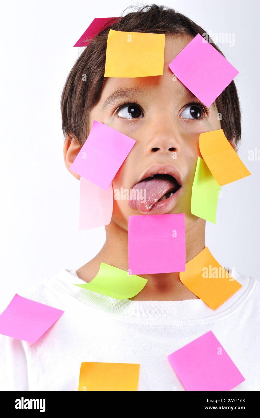 Little boy with memo notes on his face Stock Photo - Alamy