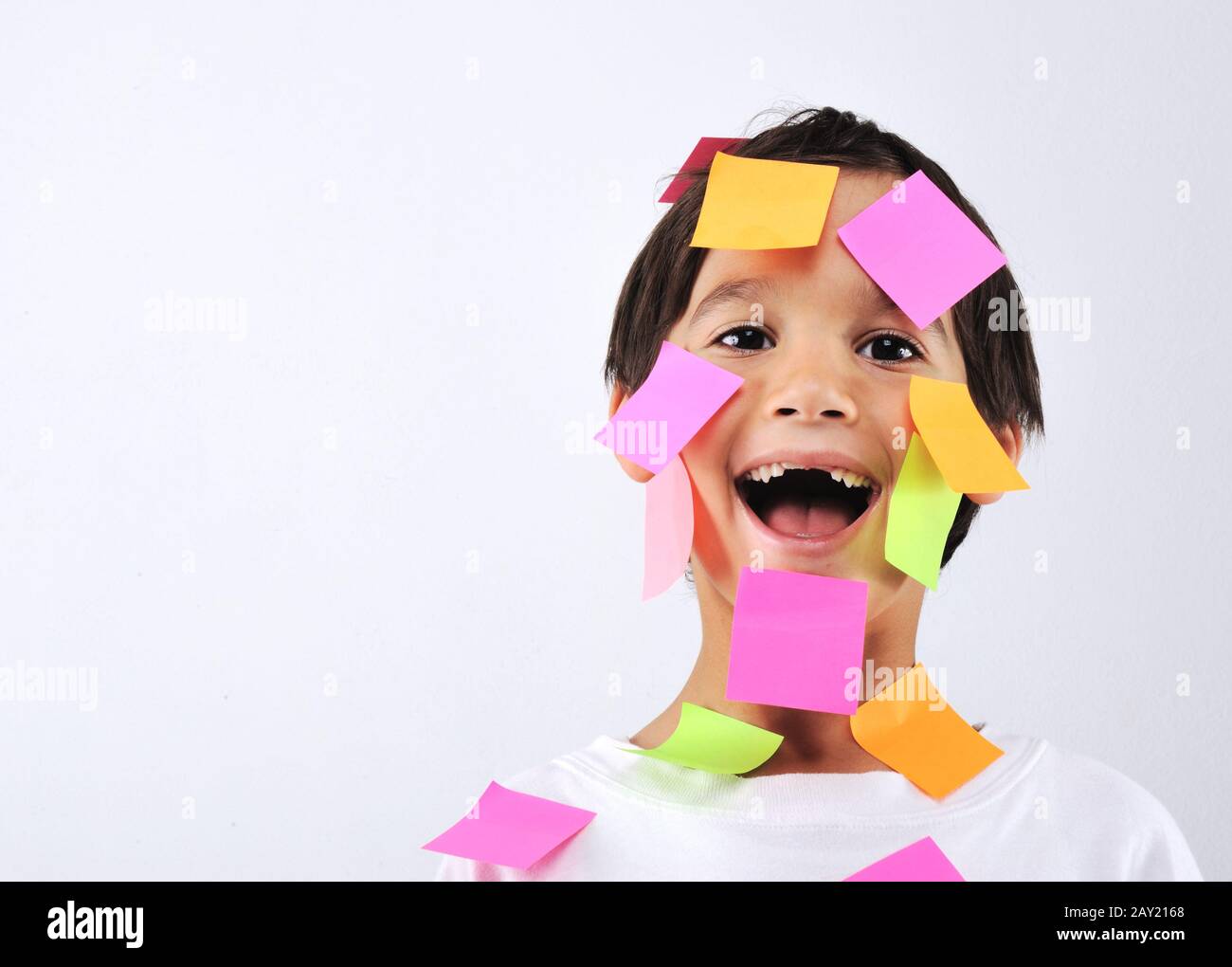 Little boy with memo posts on his face Stock Photo - Alamy