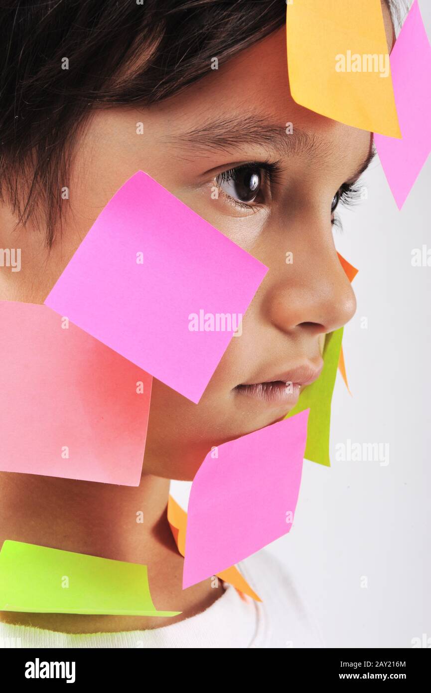 Little boy with memo notes on his face Stock Photo - Alamy