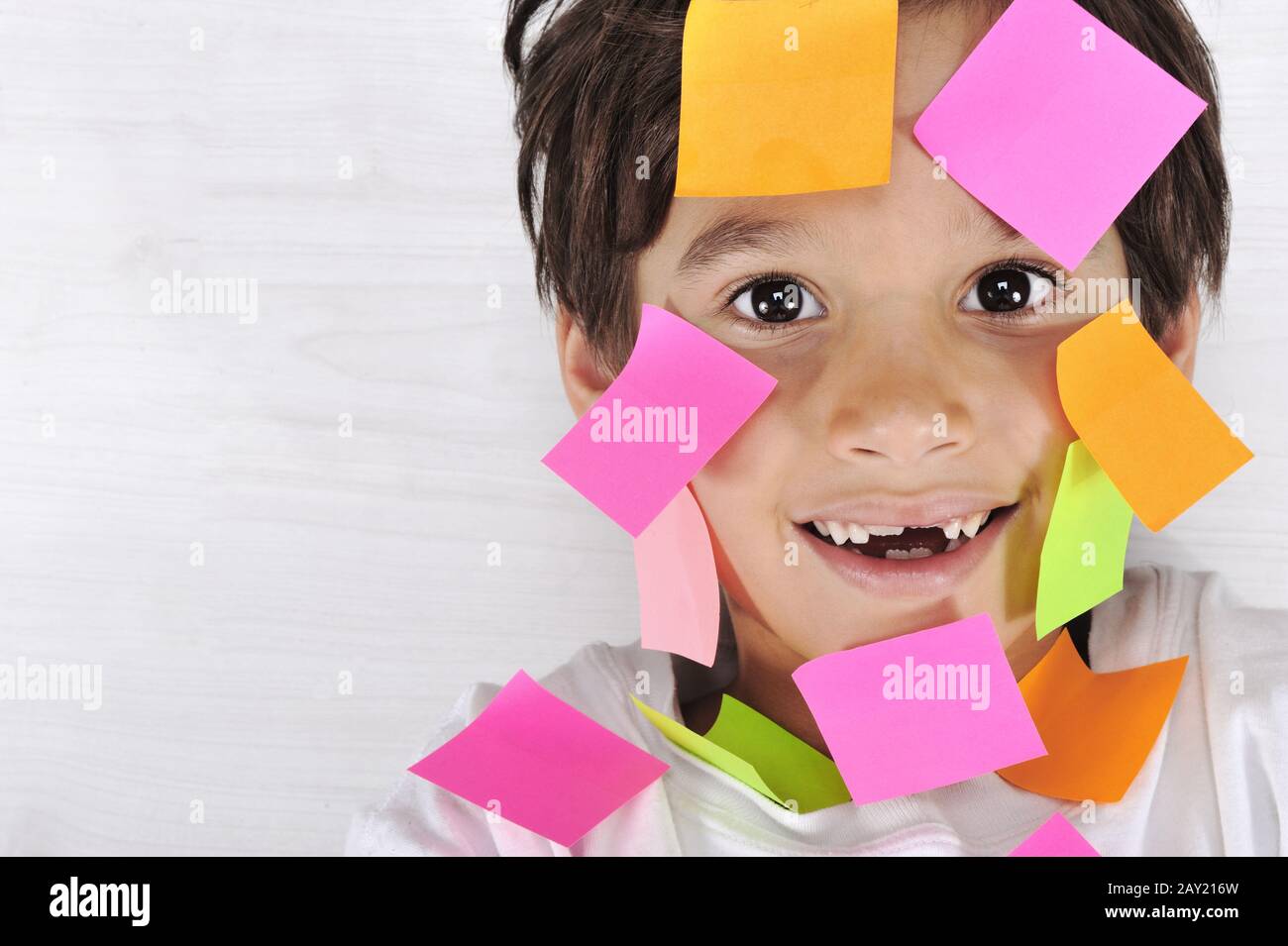 Little boy with memo notes on his face Stock Photo - Alamy