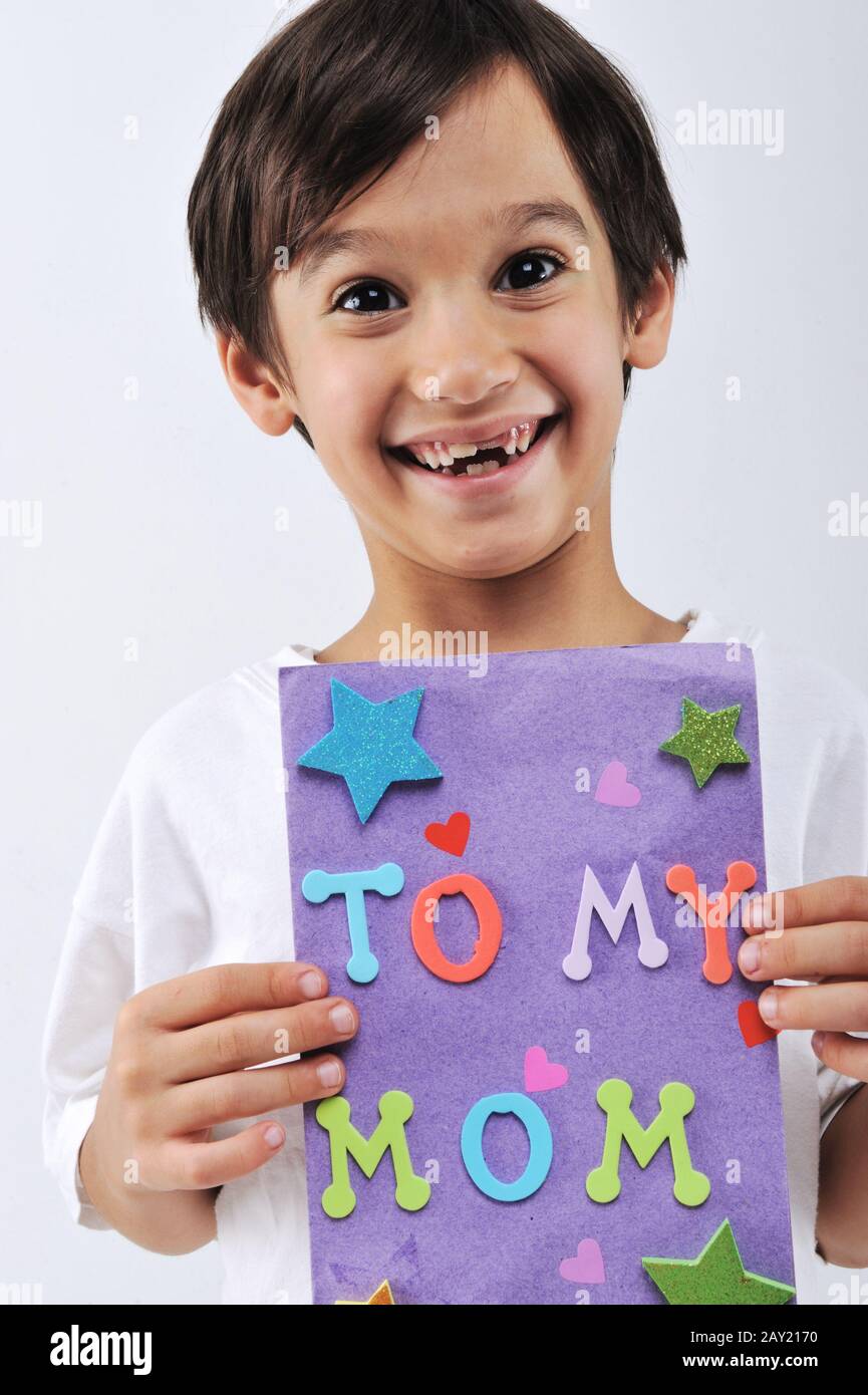 Kid holding message for lovely Mom Stock Photo - Alamy