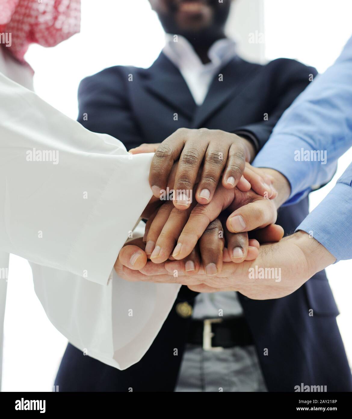 Business team overlapping hands Stock Photo - Alamy