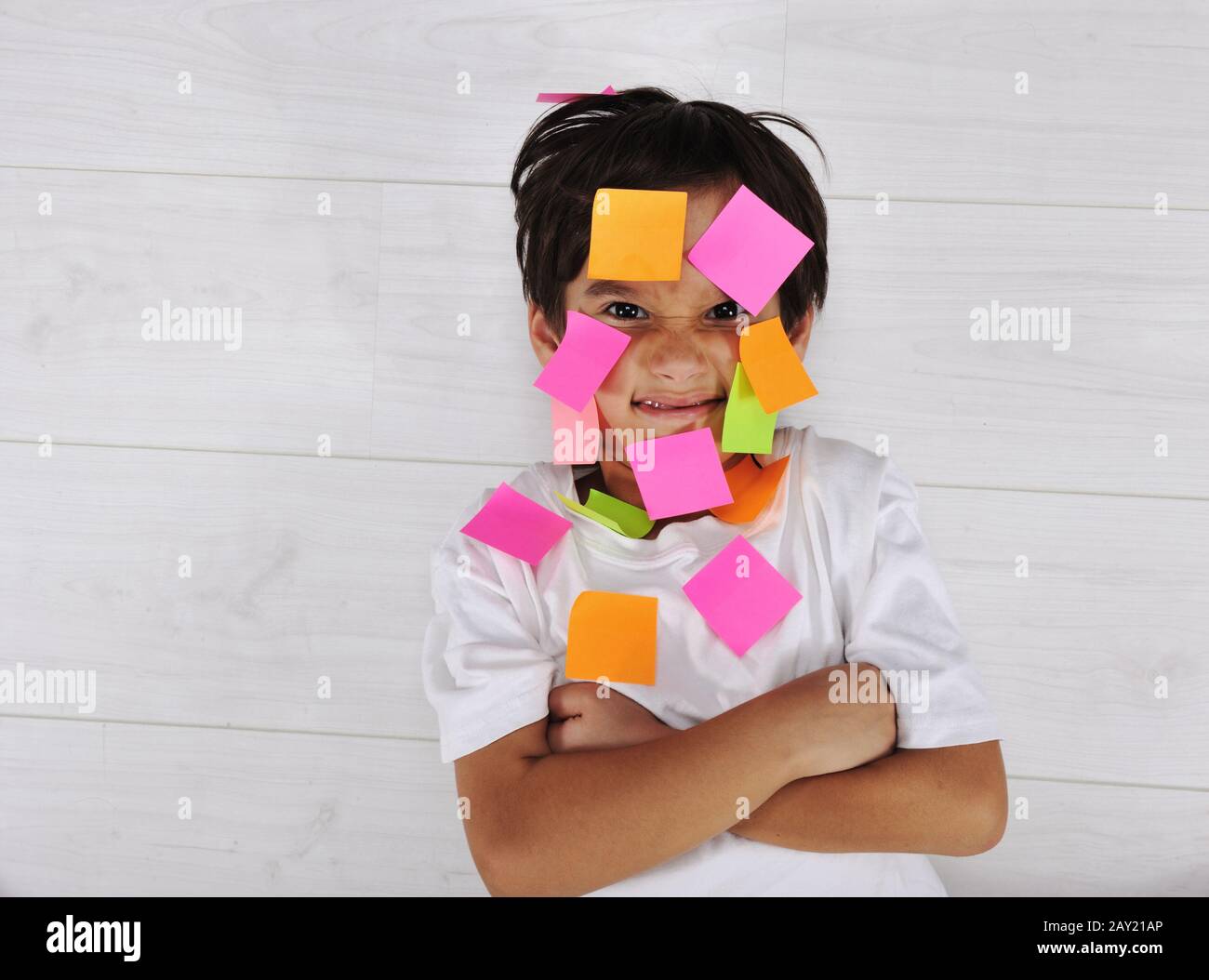 Little boy with memo posts on his face Stock Photo - Alamy