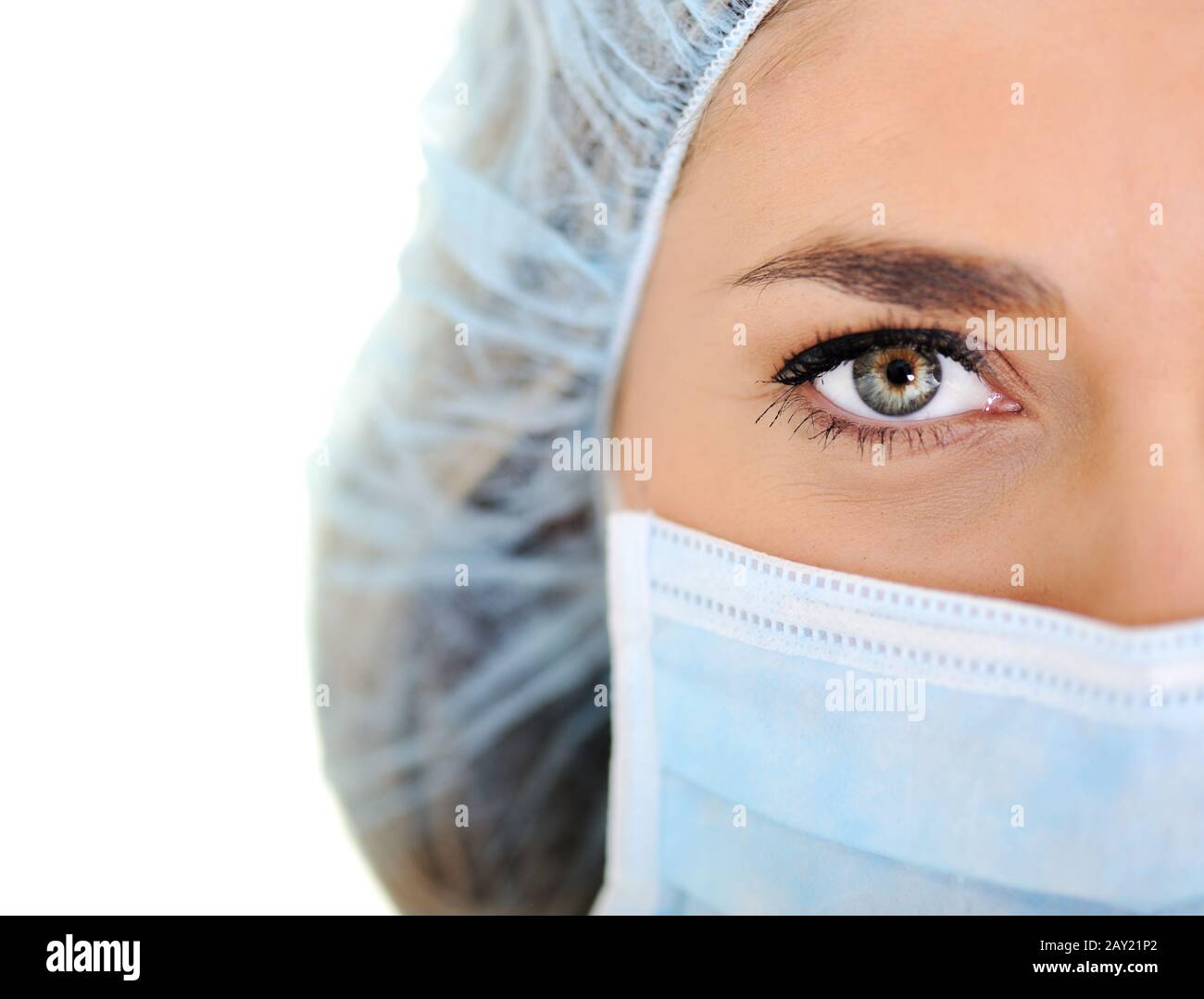 Female doctor wearing surgical cap and mask Stock Photo - Alamy