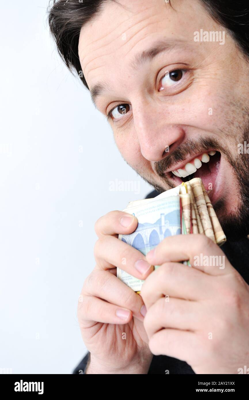 Man eating money Stock Photo - Alamy