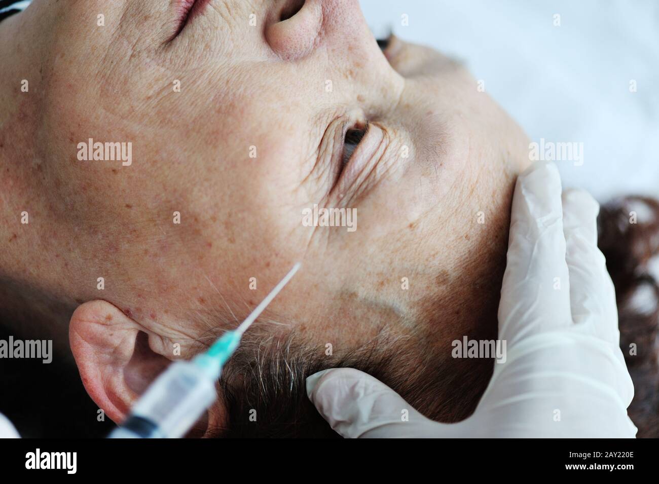Elderly woman getting Botox injection procedure Stock Photo - Alamy
