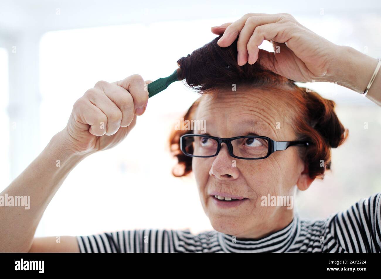 Old lady hair rollers hi-res stock photography and images - Alamy