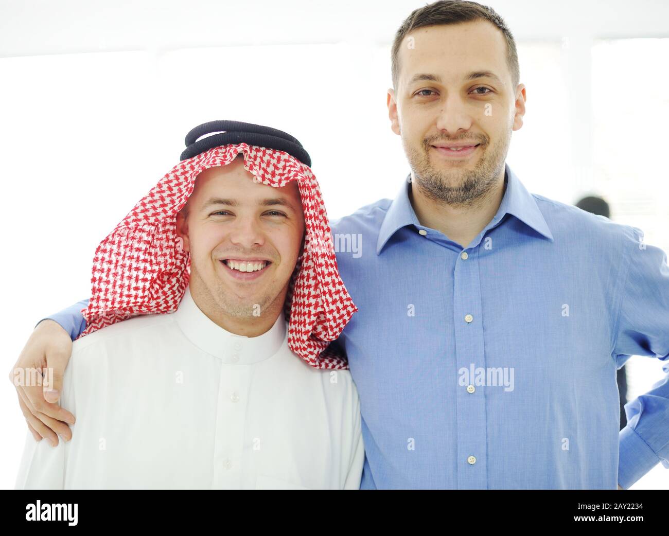 Arabic and caucasian european men together Stock Photo - Alamy