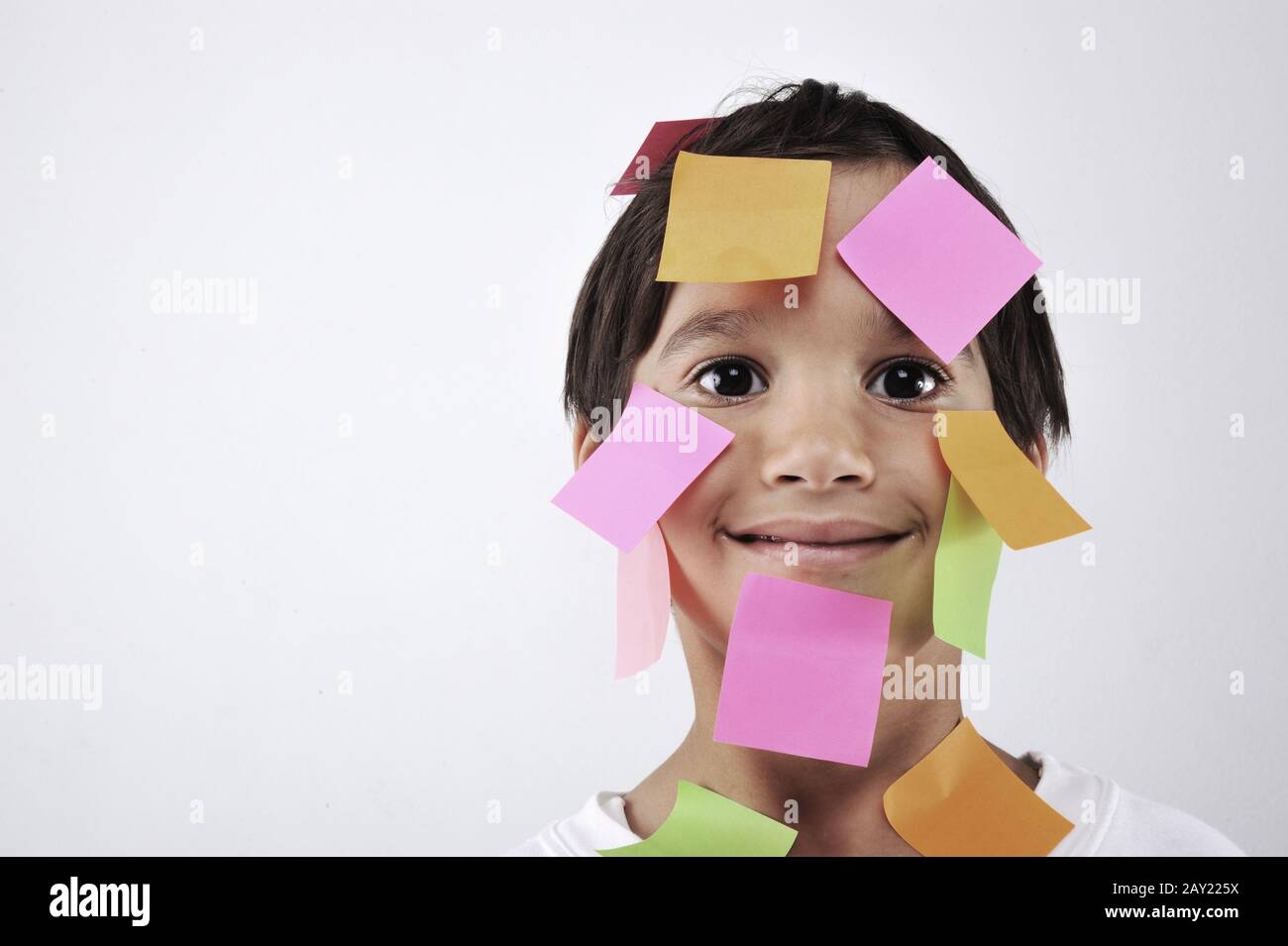 Little boy with memo posts on his face Stock Photo - Alamy