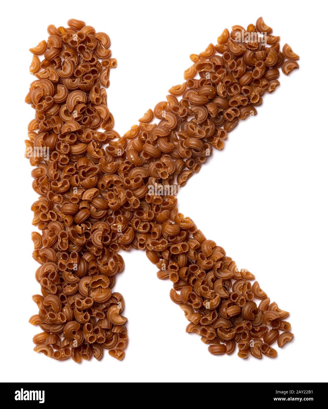 Letter K of the English alphabet from dry pasta from buckwheat amaranth ...