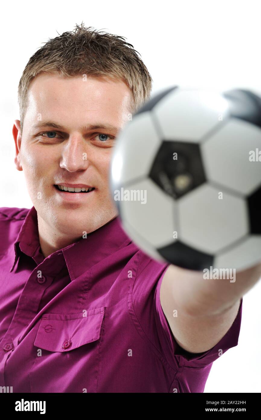 Man holding football Stock Photo - Alamy