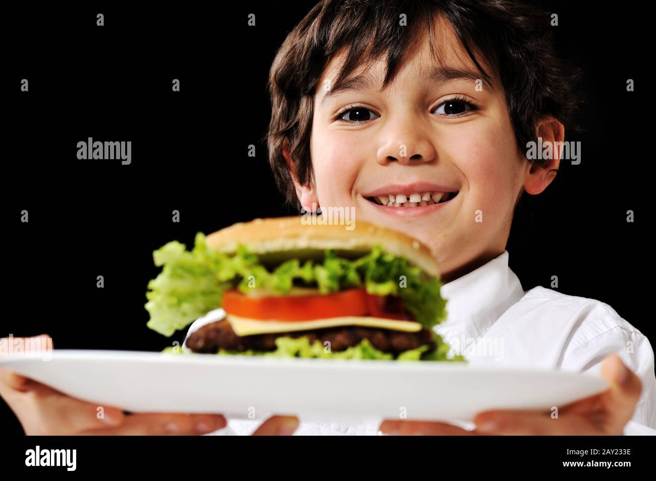 Child boy offering food hi-res stock photography and images - Alamy